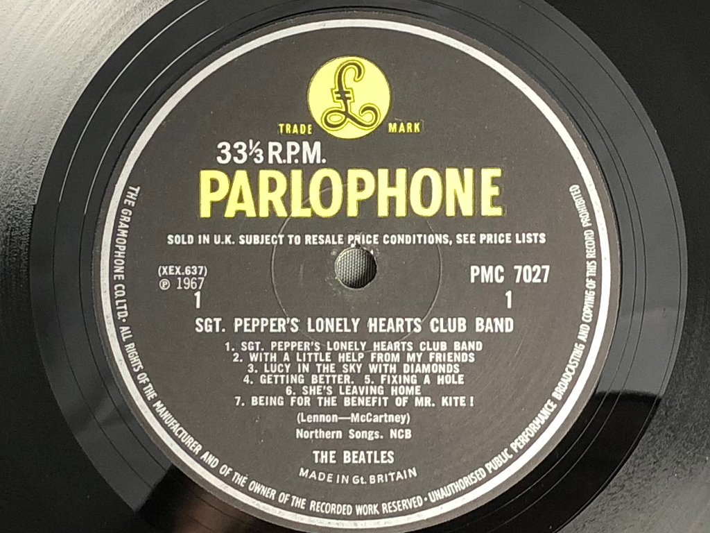 Two early pressings of The Beatles' records How Much Do They Worth ...